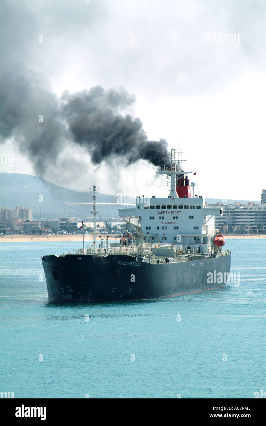 Cargo ship belching out black smoke & soot emissions from funnel ...