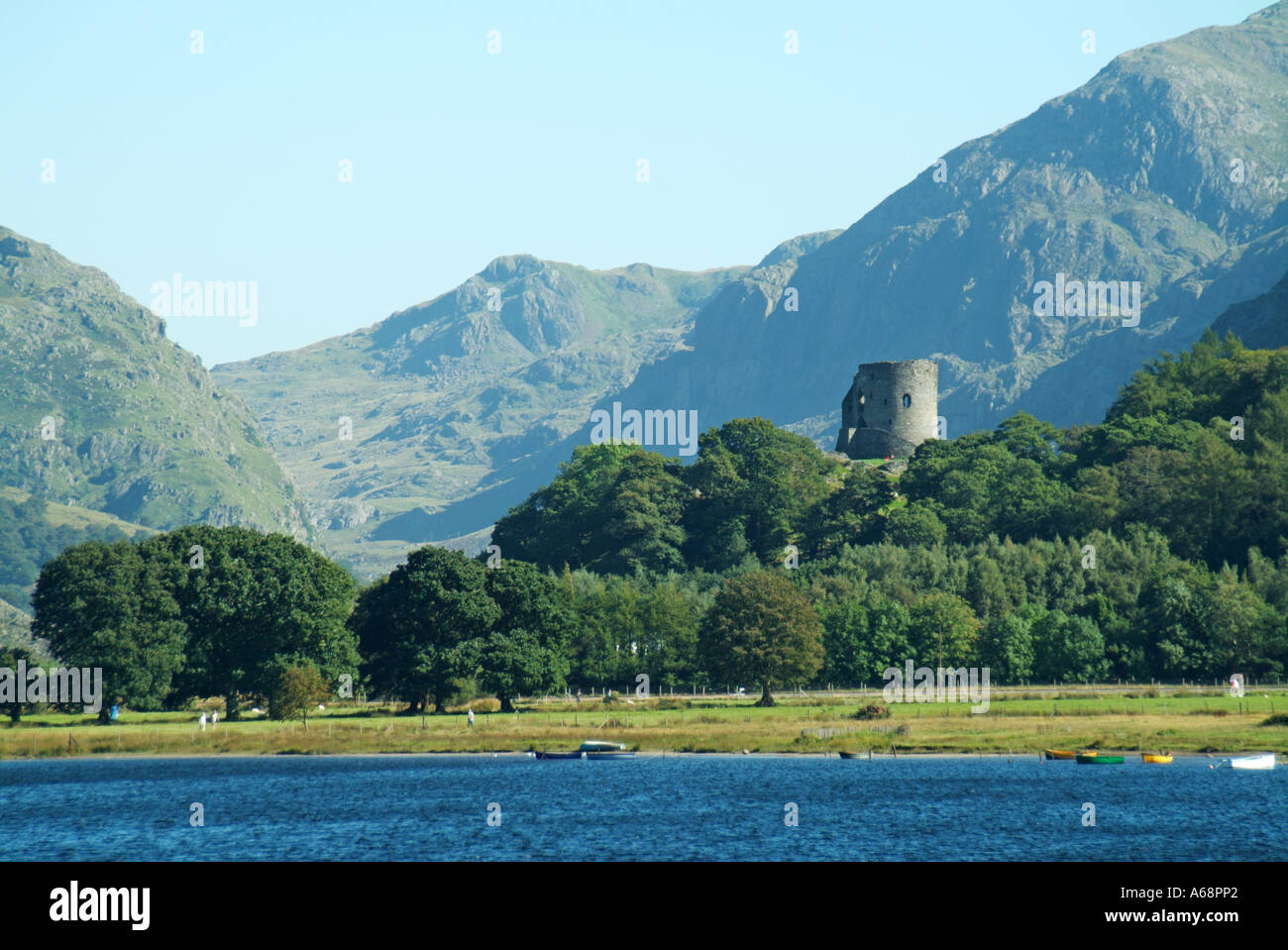 Llyn Padarn a moraine dammed glacially formed lake with ruined tower of ...