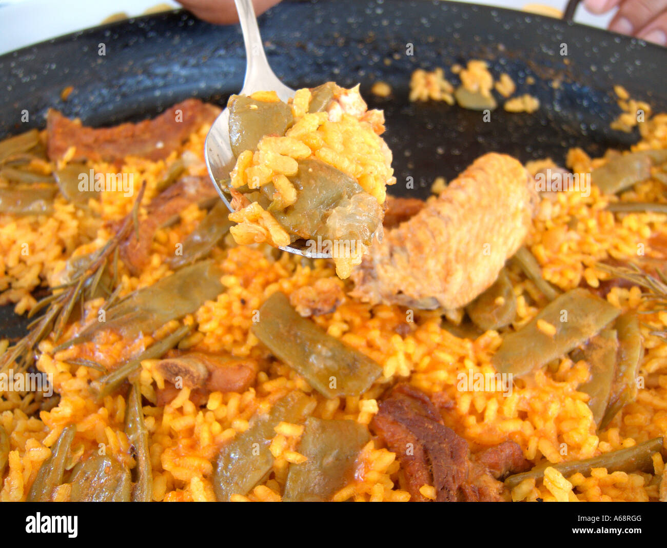 Eating paella. Traditional dish from Valencia. Spain Stock Photo - Alamy