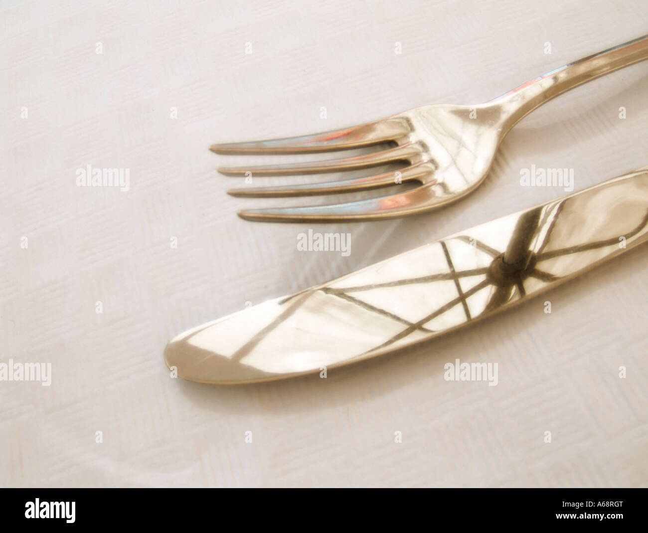 Cutlery on a white table Stock Photo - Alamy