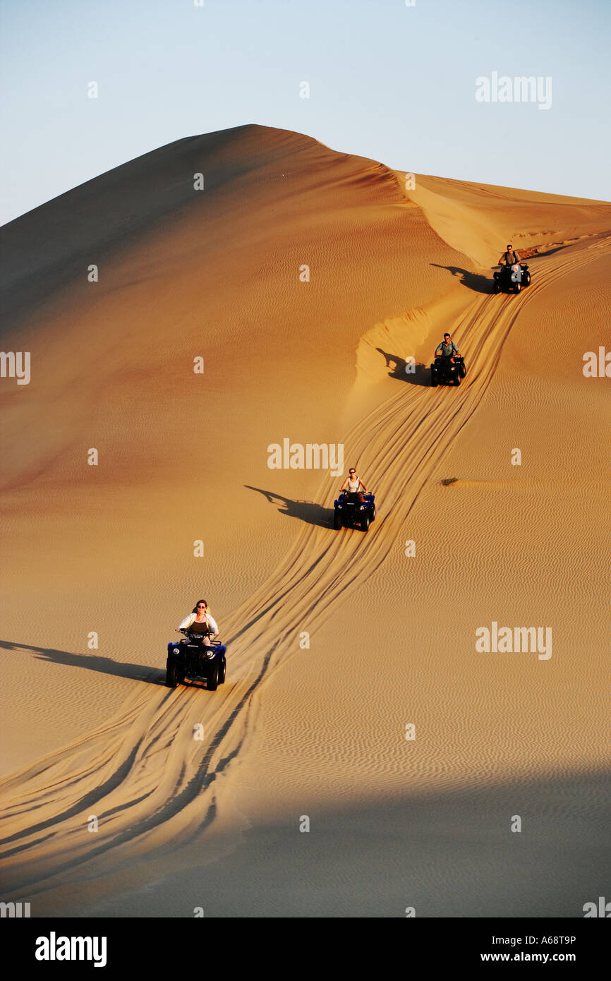 Group of tourists on quadbikes enjoying the challenges offered by the ...