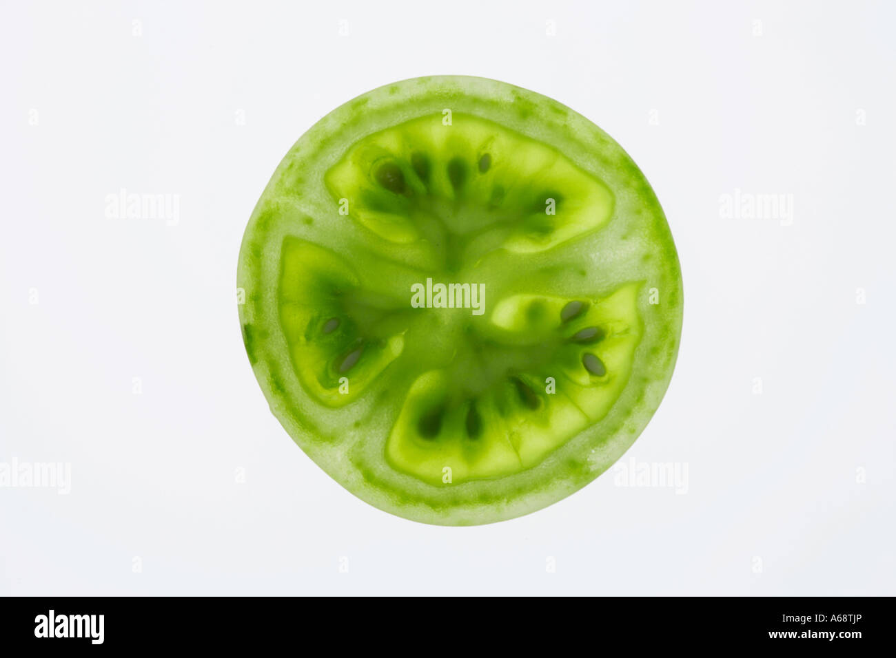 Cross section of green tomatoe Stock Photo - Alamy
