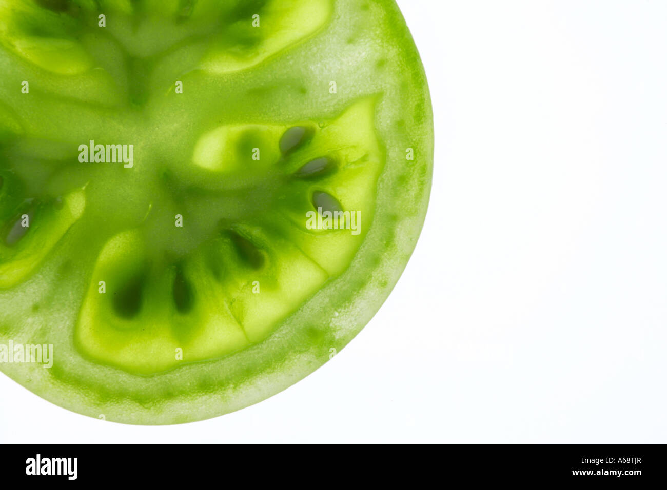 Cross section of green tomatoe Stock Photo - Alamy