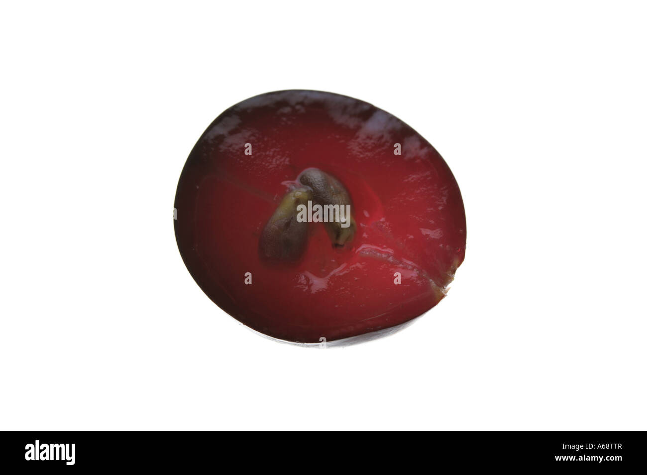 A single grape halved Stock Photo - Alamy