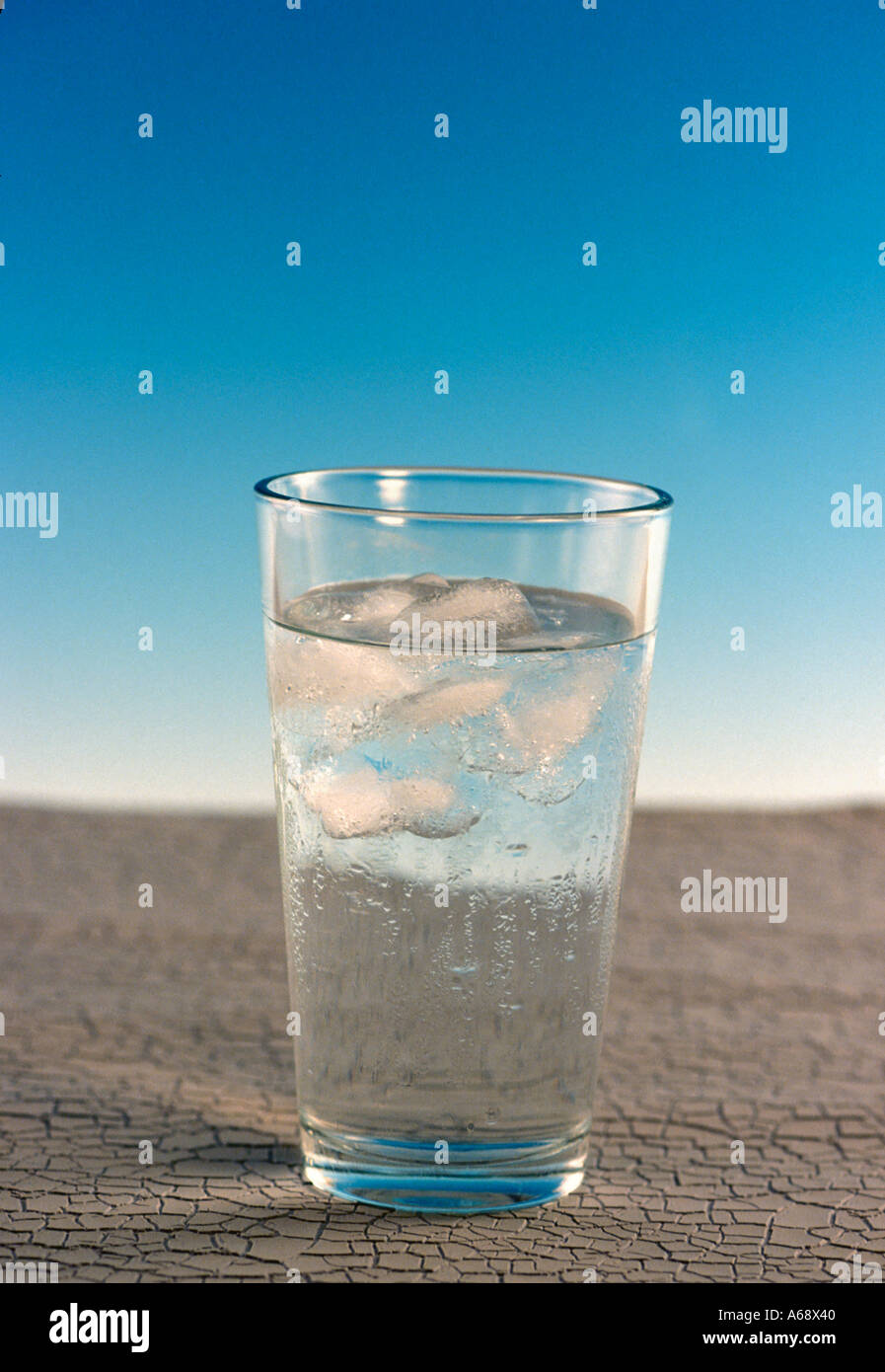 Glass half ice half water Stock Photo - Alamy
