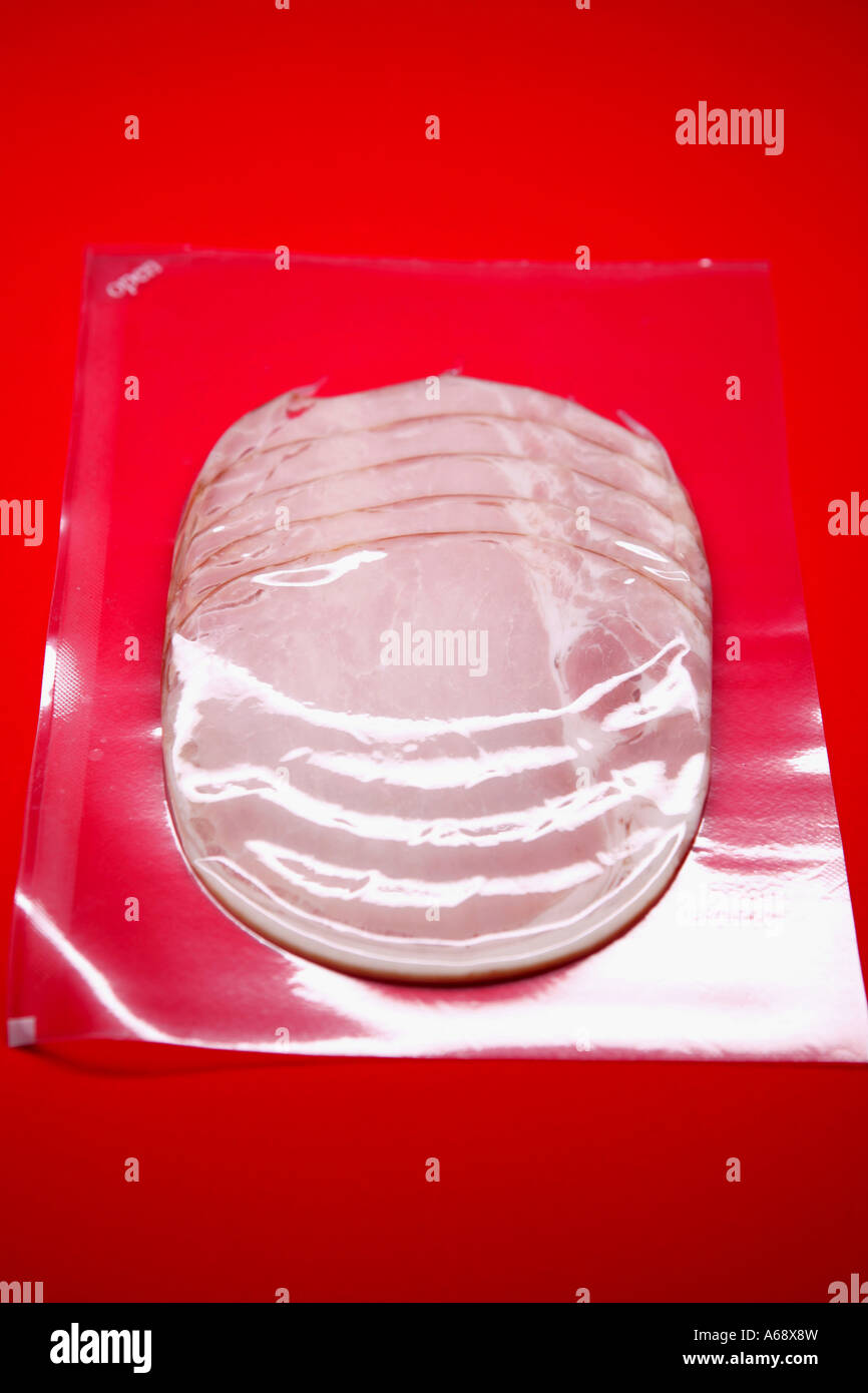 Sliced ham wrapped in plastic Stock Photo - Alamy