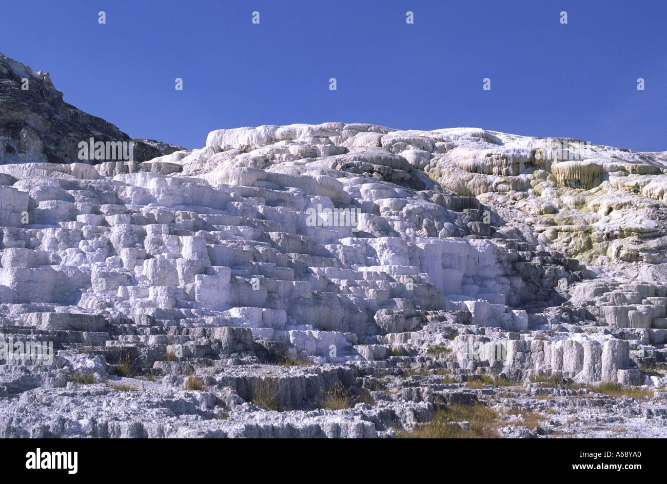 A dry terraced hillside of sparkling mineral deposits left after a ...