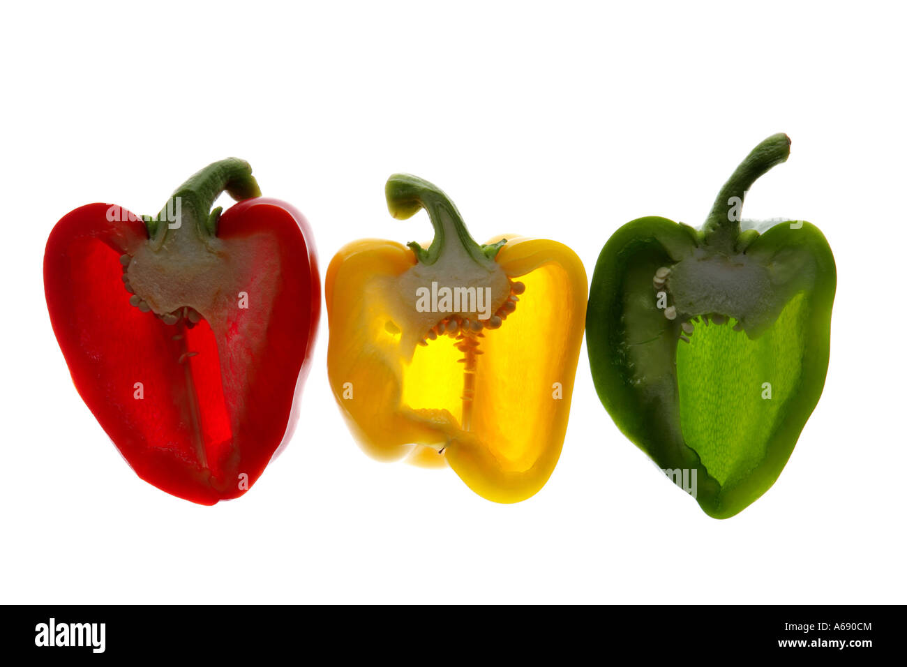 Red yellow and green pepper cross section Stock Photo - Alamy