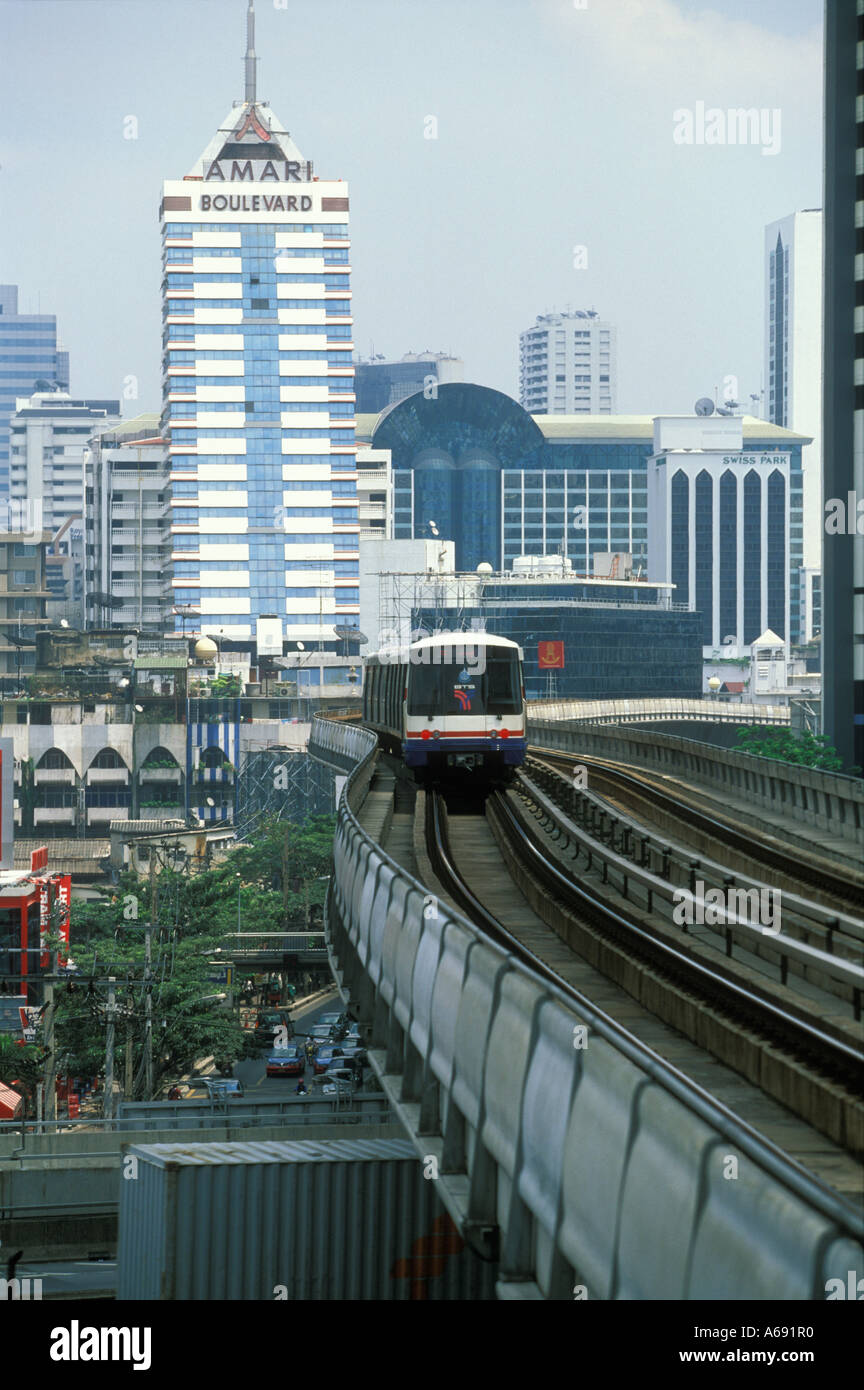 A Skytrain monorail viewed from Phloen Chit Station runs past ...