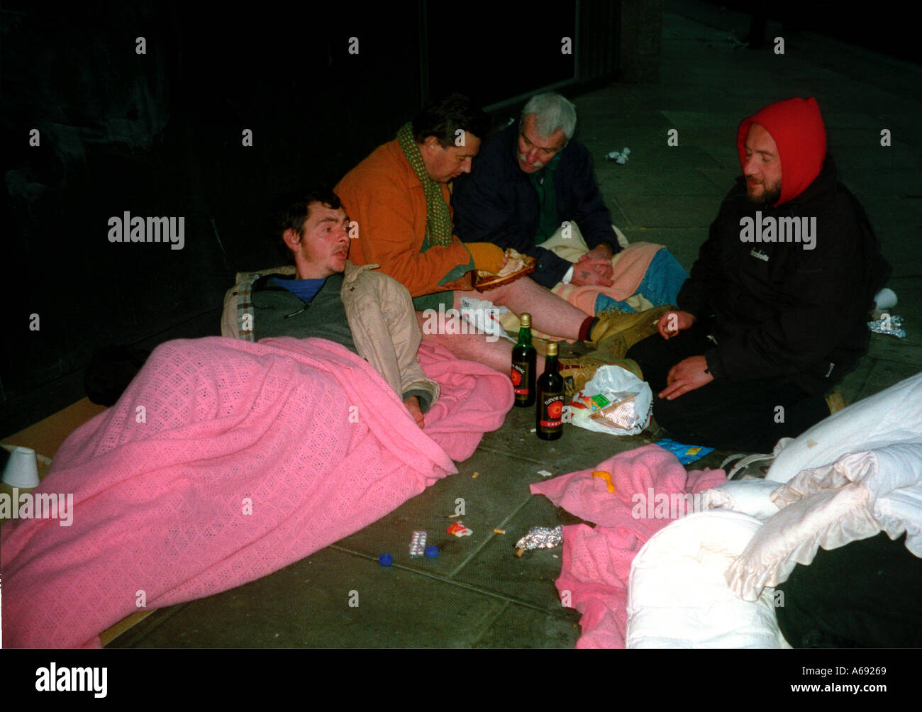 Two homeless men settling down for the night, Victoria Street, London ...