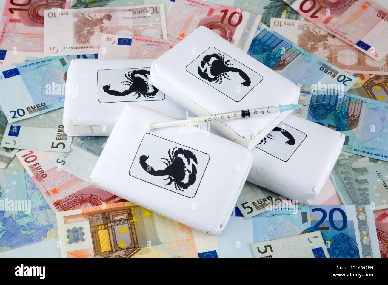 Packaged drugs with Euro cash and syringe Stock Photo - Alamy