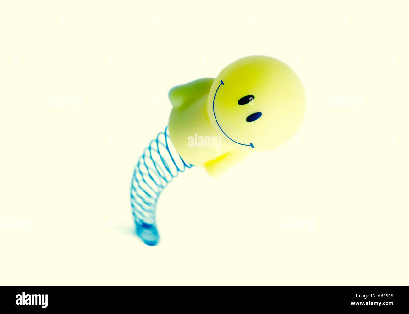 happy wind up toy on spring Stock Photo - Alamy
