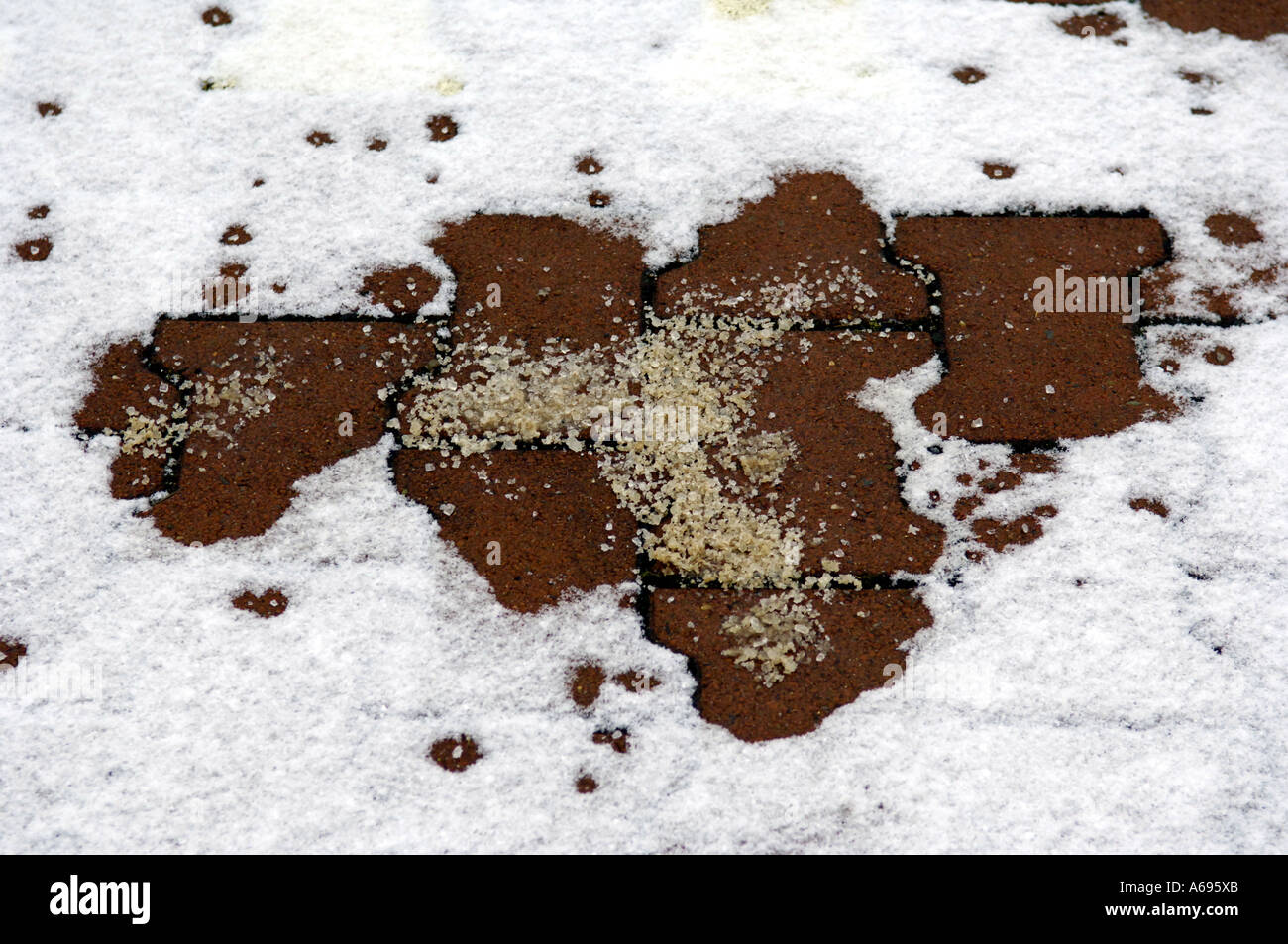 salt grit gritted pavement sidewalk brick floor ground melt melting ...