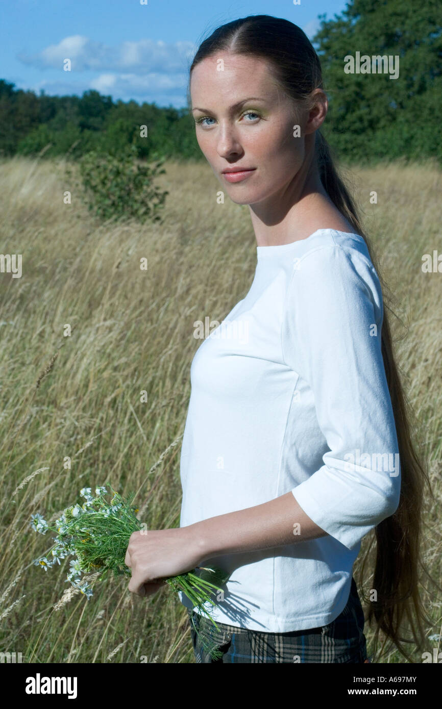 young woman walking on field Stock Photo - Alamy