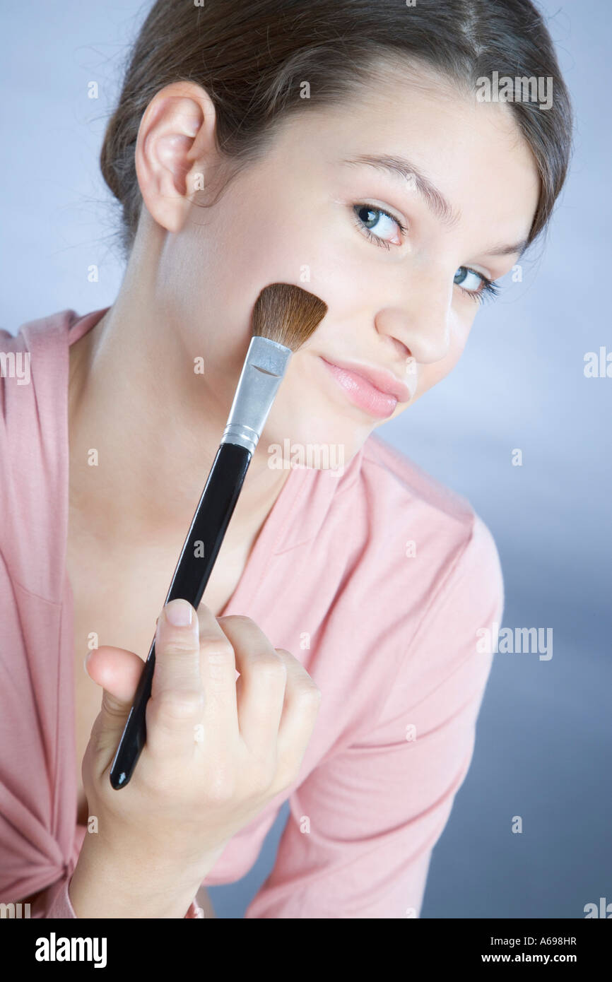 Woman powdering her nose hi-res stock photography and images - Alamy