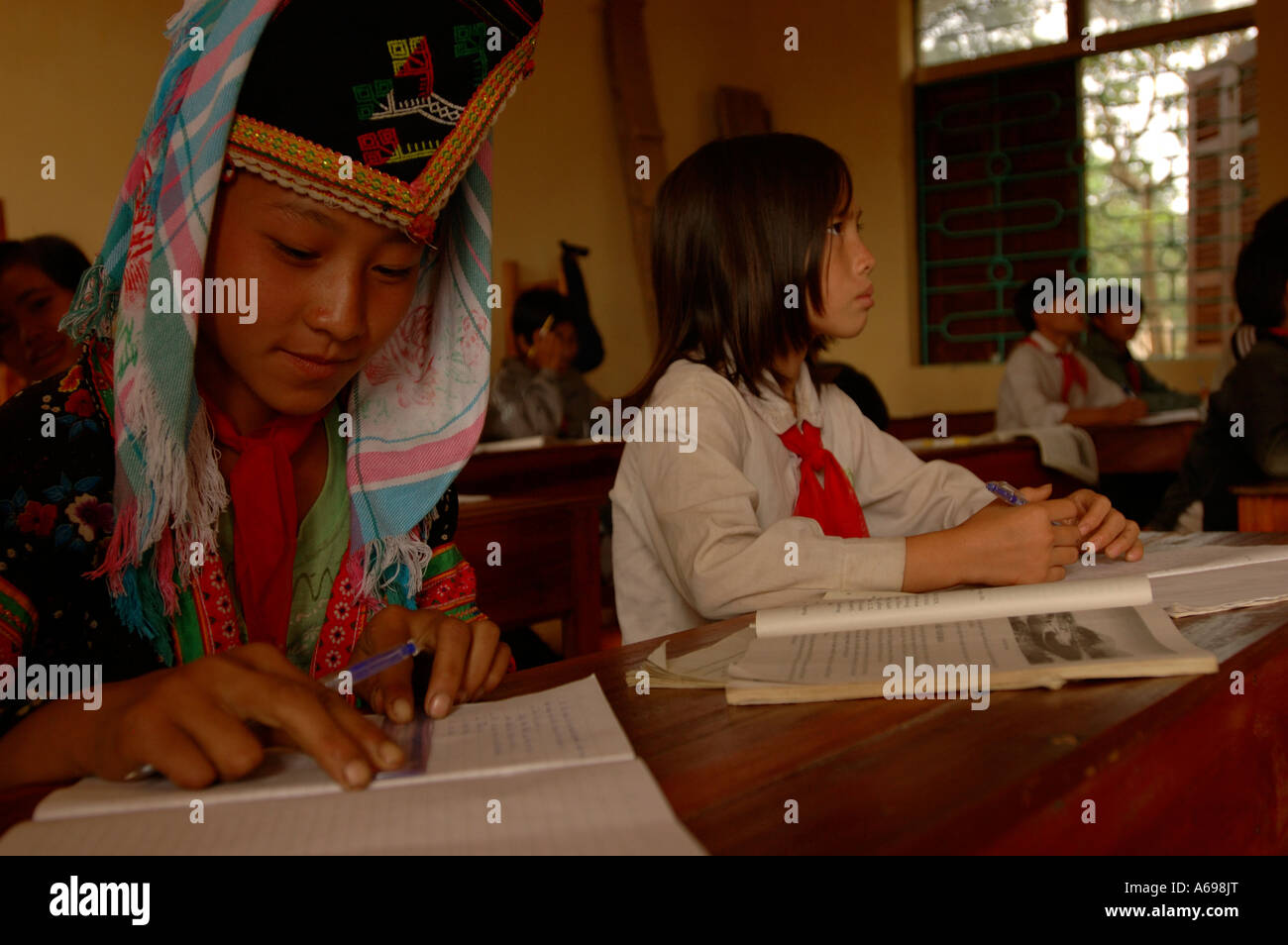 A Blue Hmong indigenous girl dressed in colorful traditional clothing ...
