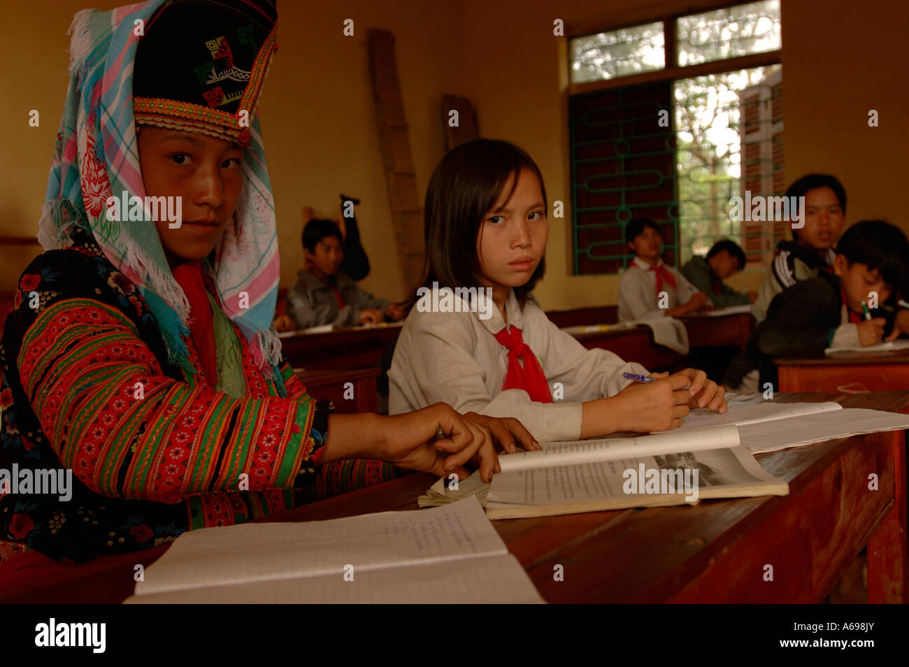 A Blue Hmong indigenous girl dressed in colorful traditional clothing ...