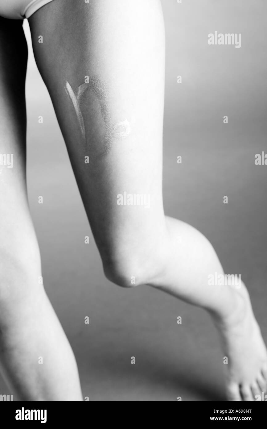 horoscope sign on leg Stock Photo - Alamy