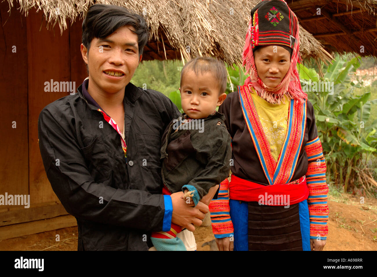 A Blue Hmong indigenous family wearing traditional cloth proudly poses ...