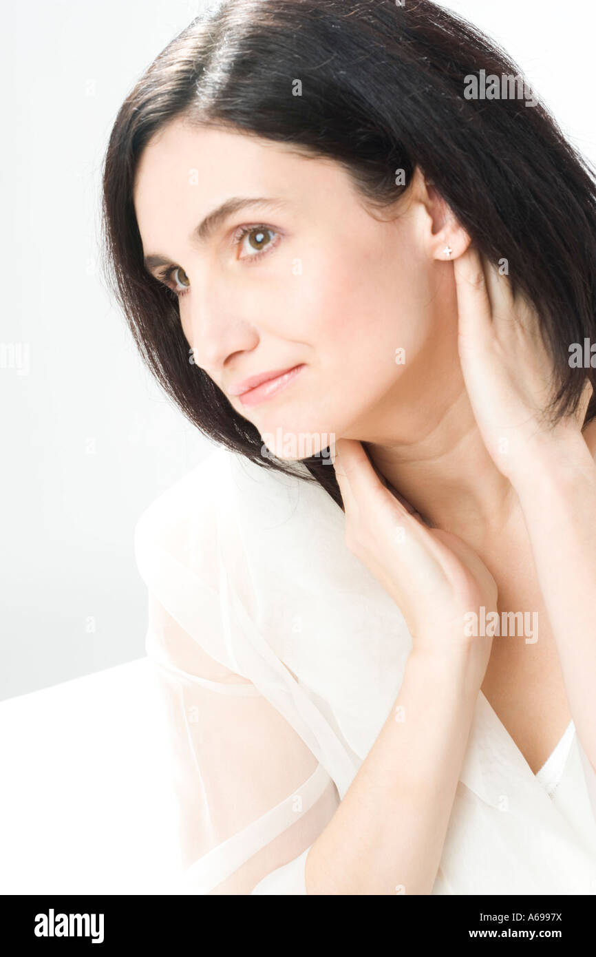 woman touching neck Stock Photo - Alamy