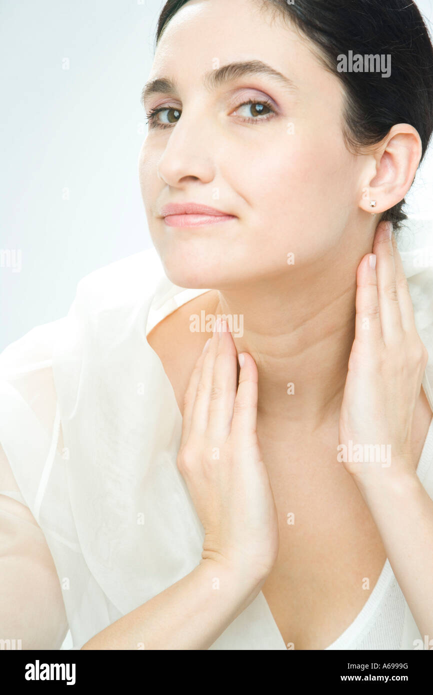 woman touching neck Stock Photo - Alamy