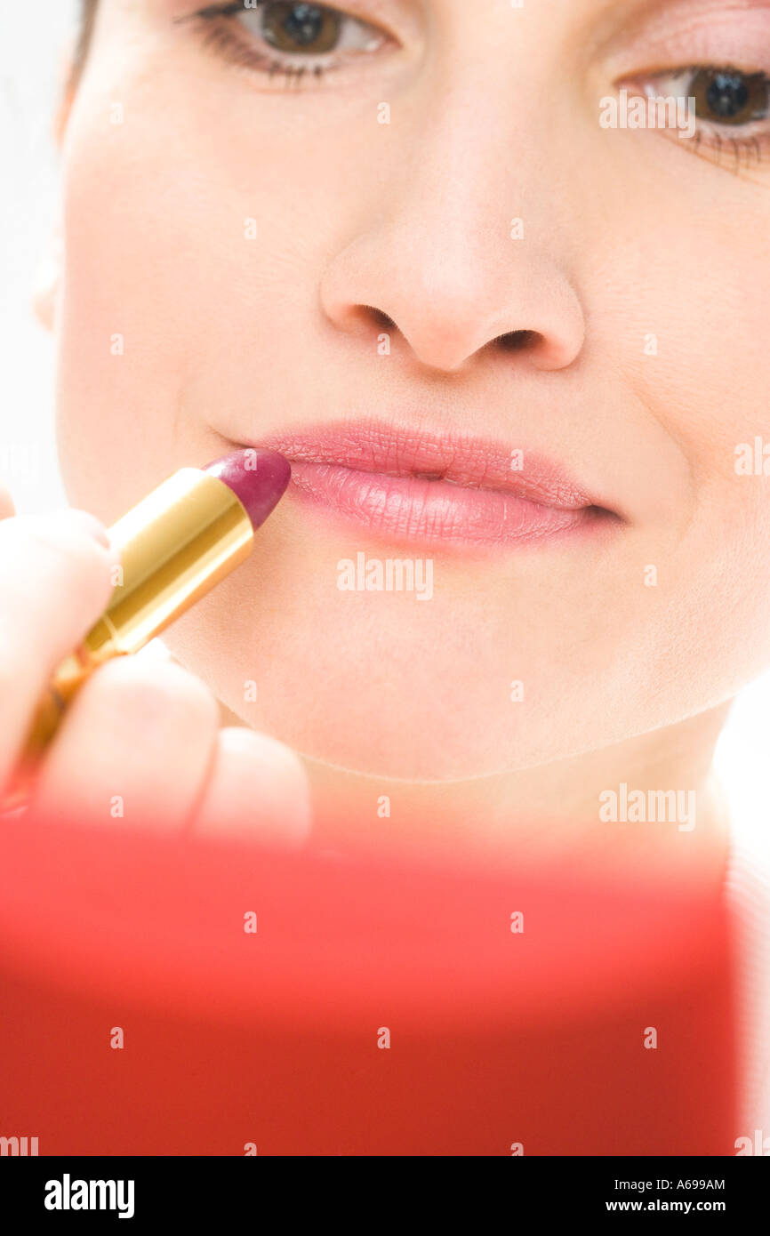 woman applying lipstick Stock Photo - Alamy