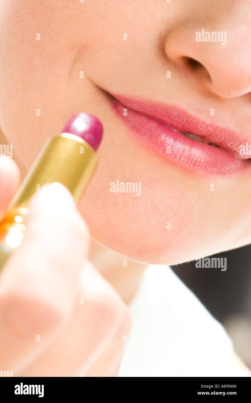 woman applying lipstick Stock Photo - Alamy