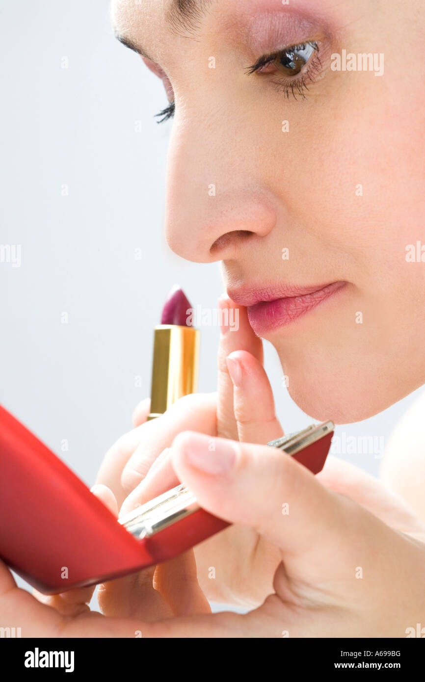 woman applying lipstick Stock Photo - Alamy