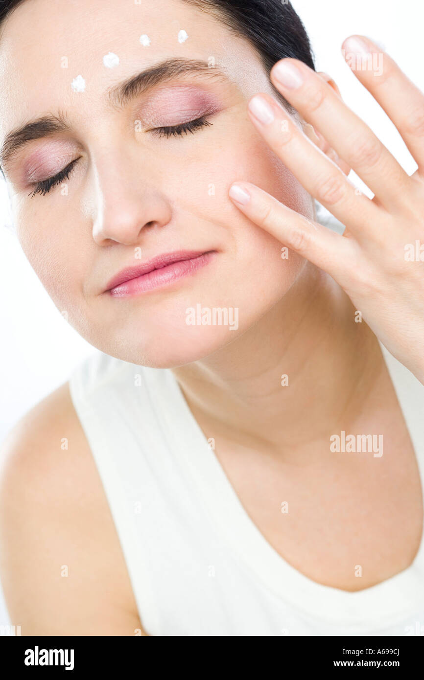 woman creaming face Stock Photo - Alamy
