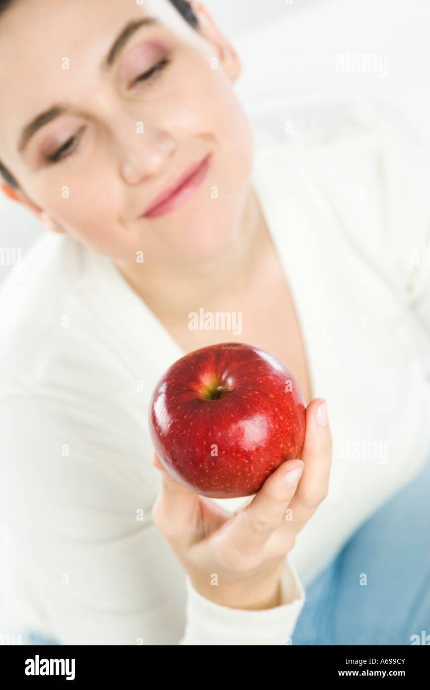 woman holding apple Stock Photo - Alamy