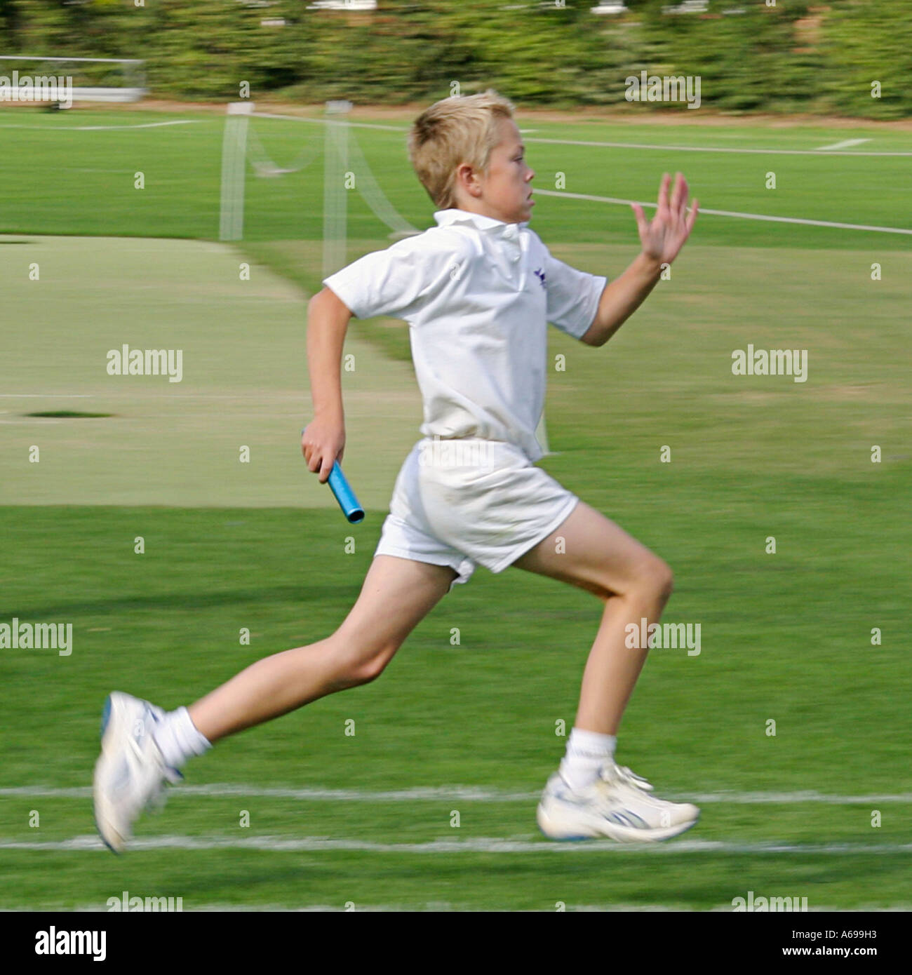 Boy sprinting in school sports day relay race Stock Photo - Alamy