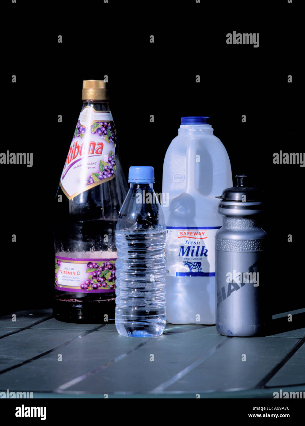 Display of plastic bottles and containers on a plastic garden table ...