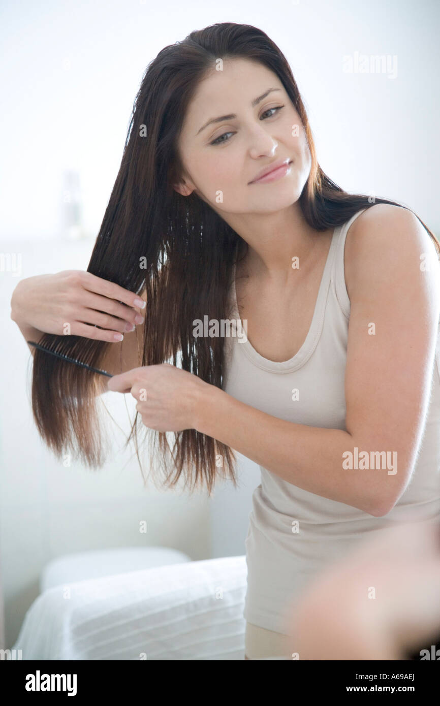 woman combing hair Stock Photo - Alamy