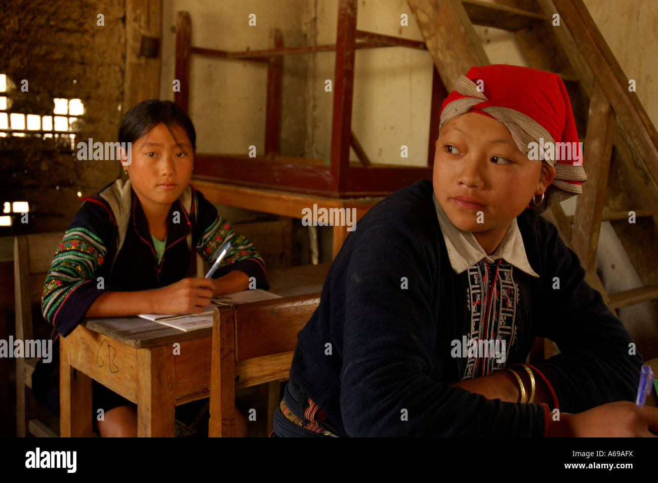 Red Dao and Black Hmong children dressed in traditional clothing study ...