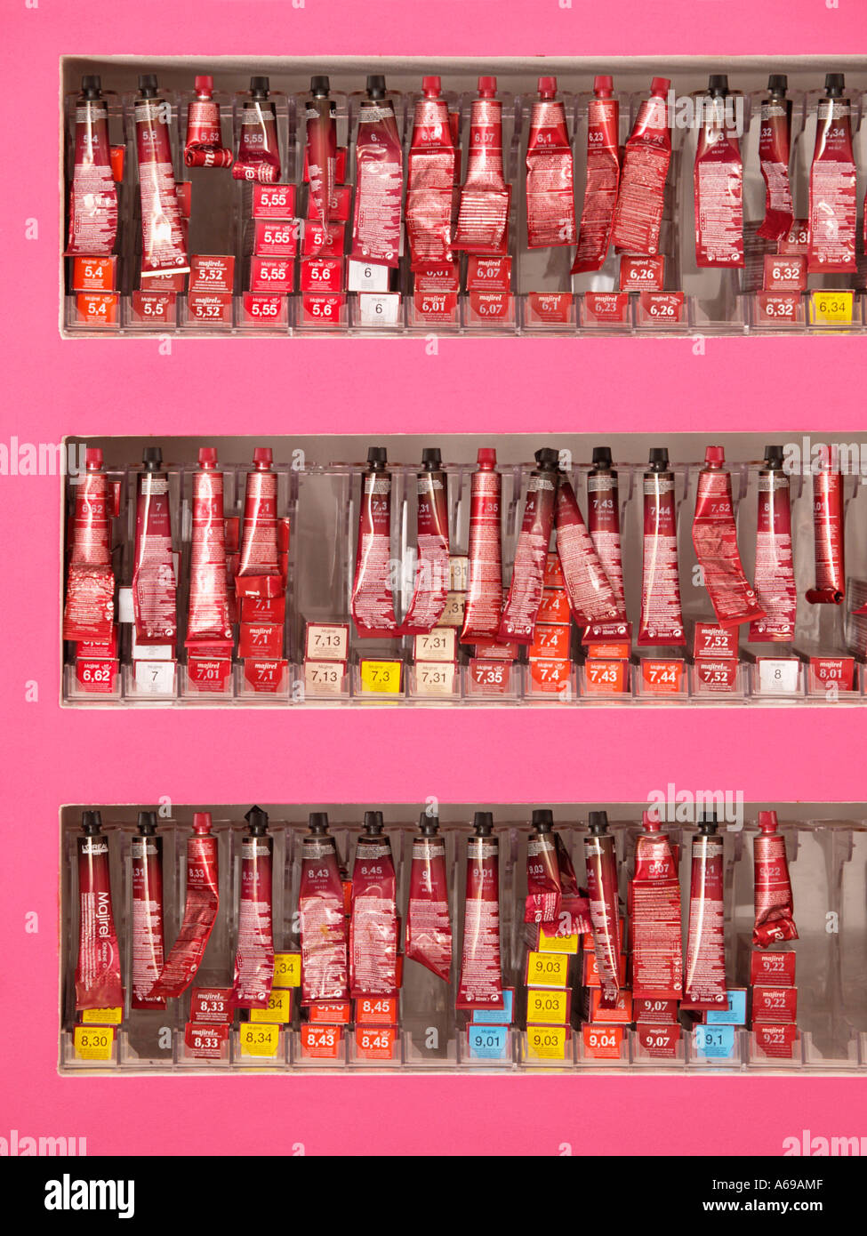 Pink shelves with many hair dye tubes in various colors Stock Photo - Alamy