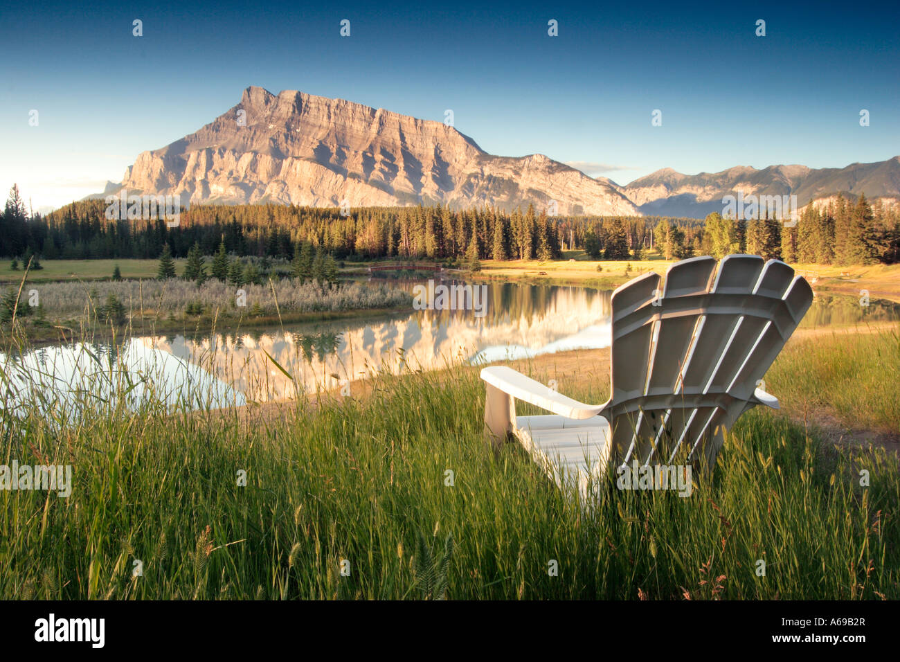 Chair overlooking mountain lake Banff National Park Alberta Canada ...
