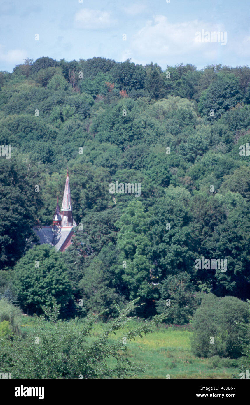 Seasons series country church in summer vertical Stock Photo - Alamy