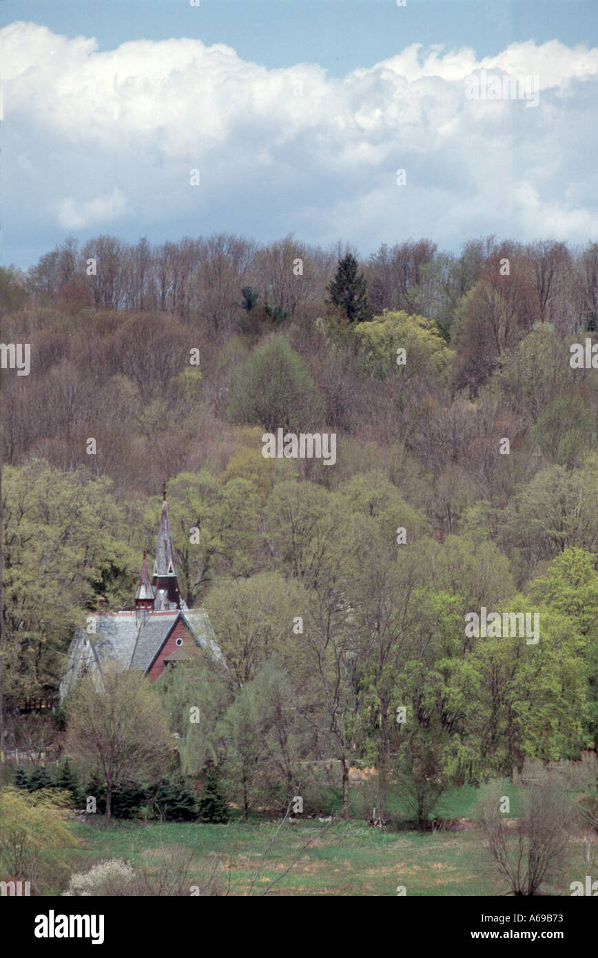 Seasons series country church in spring vertical Stock Photo - Alamy