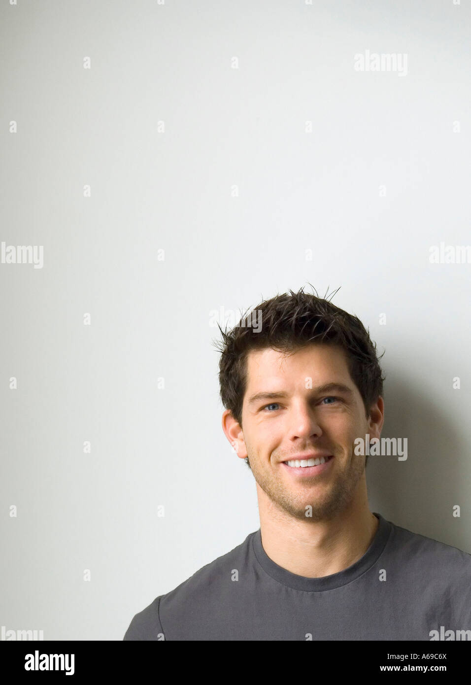 Portrait of young smiling man Stock Photo - Alamy