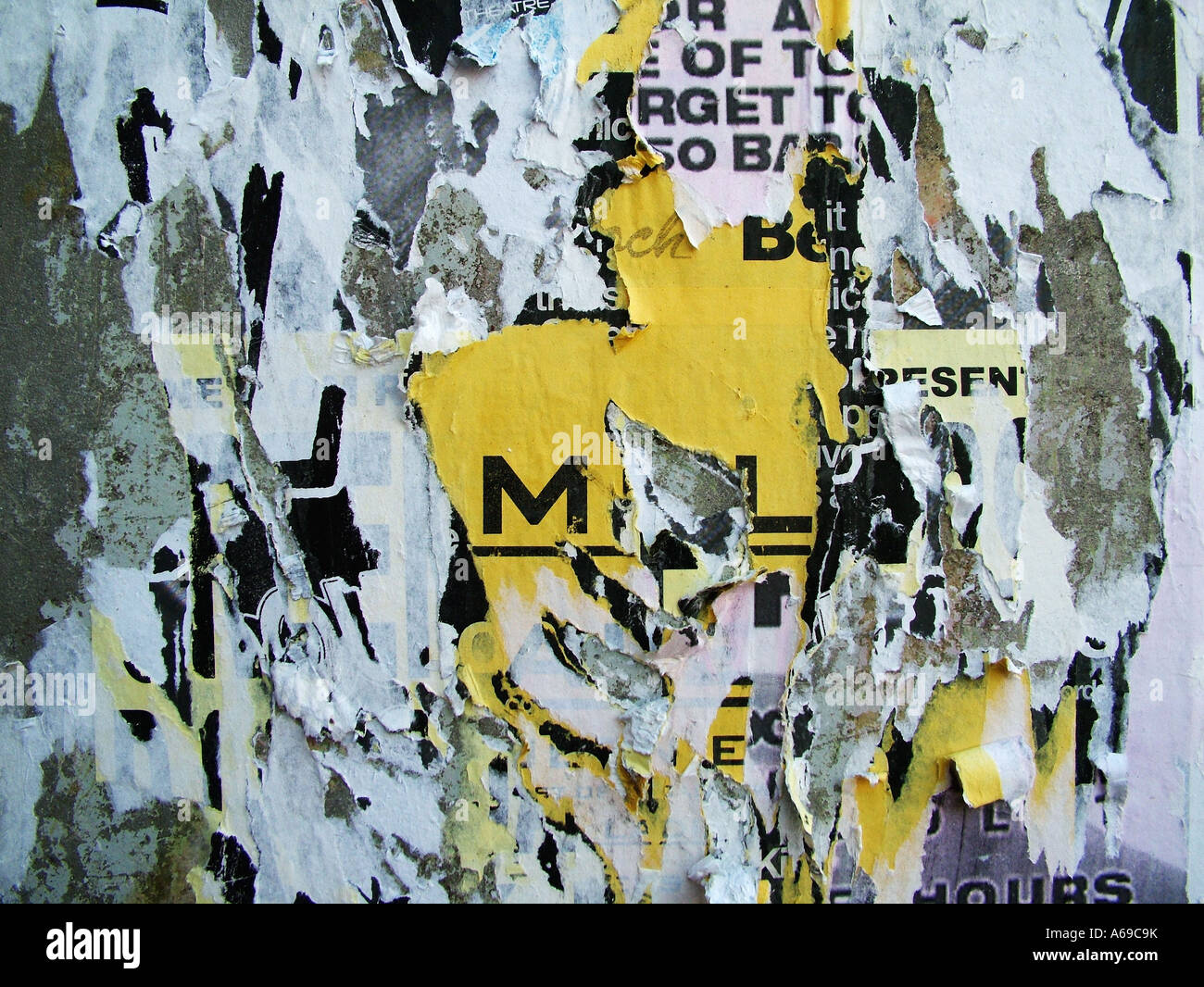 Tattered posters on a pole Stock Photo - Alamy