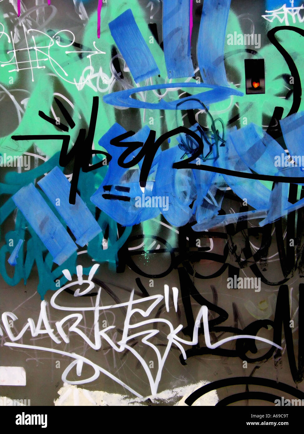 Layers of graffiti on urban wall Stock Photo - Alamy