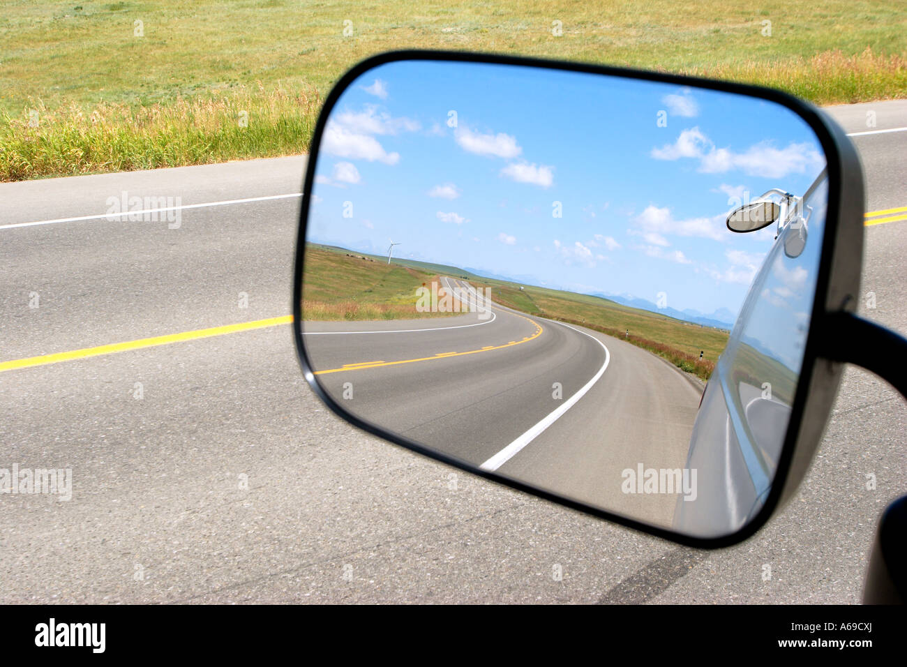 Side mirror on cargo van looking down highway Stock Photo - Alamy