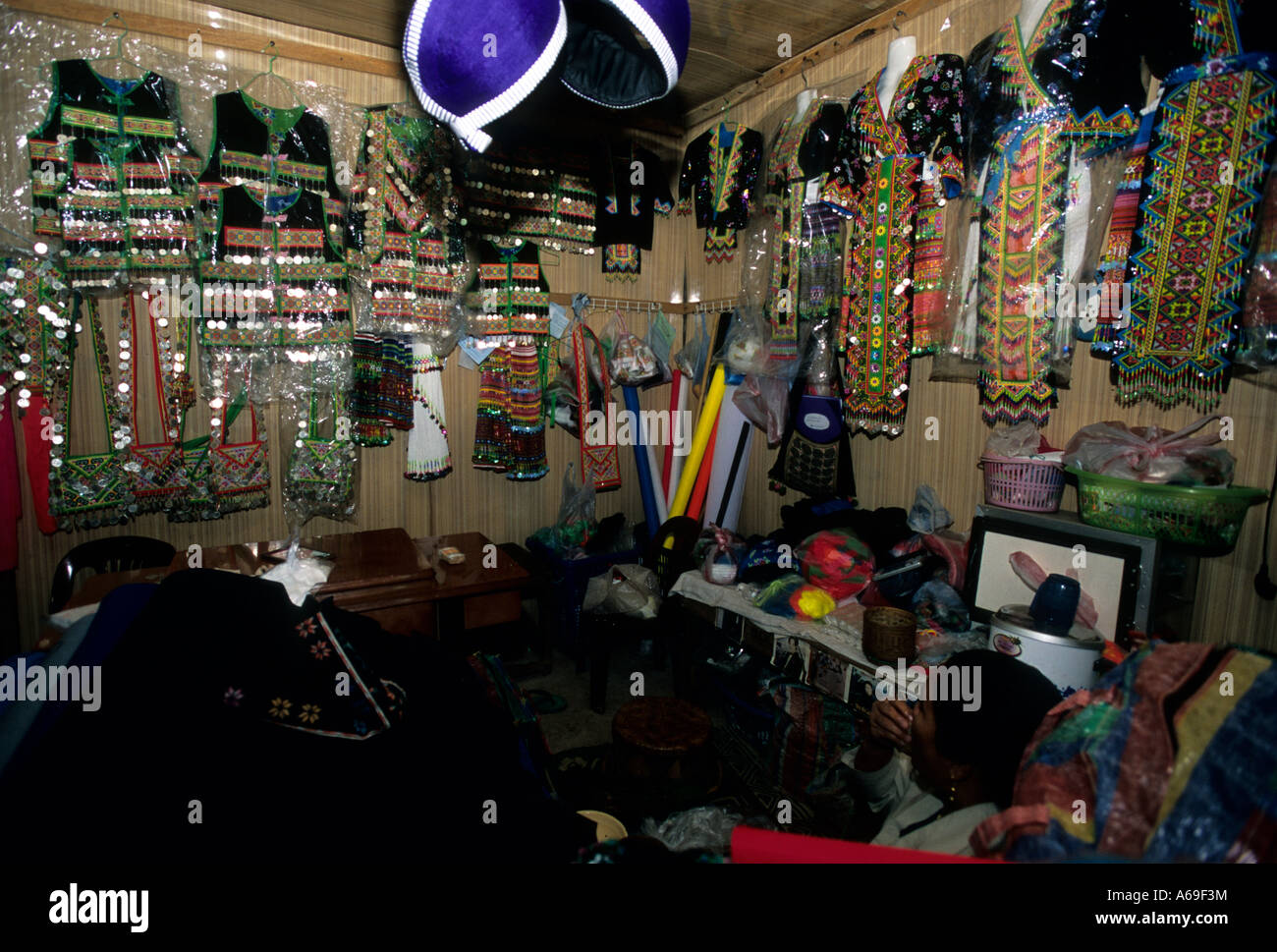 Small shop in the market of Sam Neua, Laos, displays traditional ...