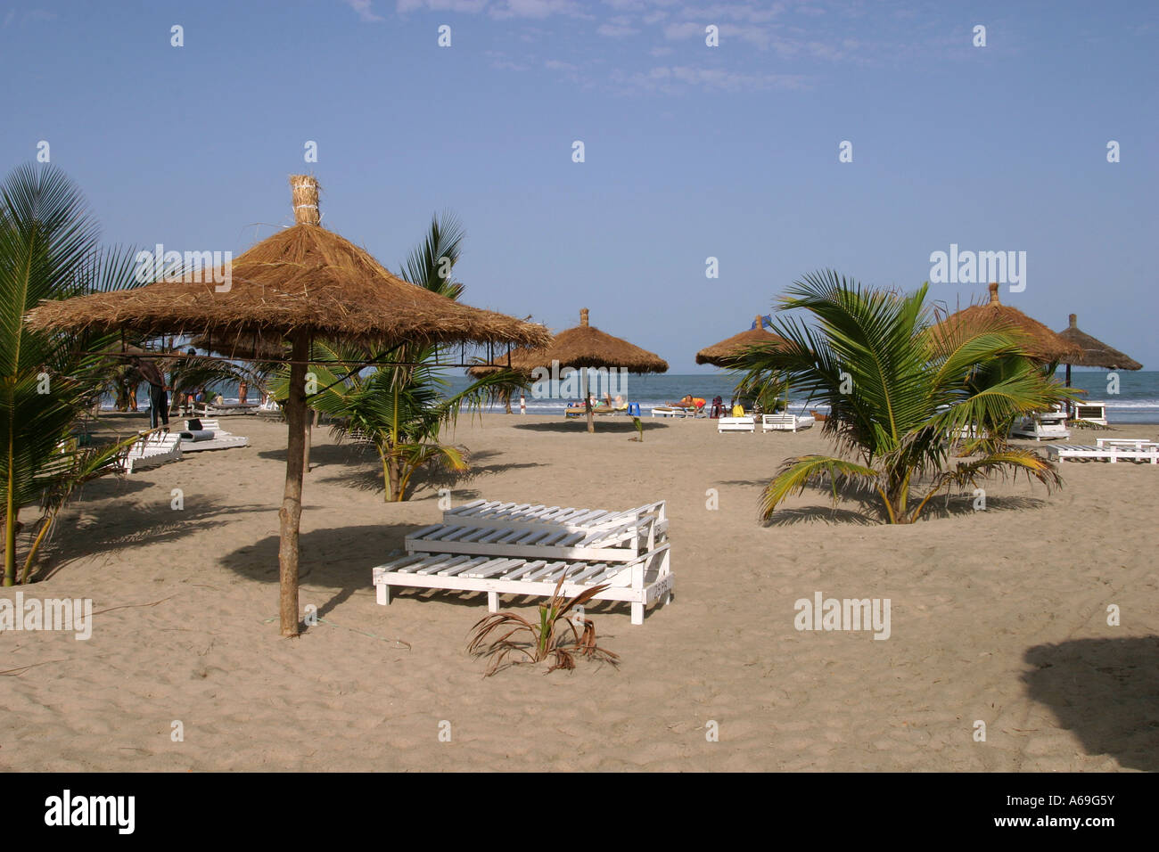 The Gambia Fajara beach empty sunbeds under parasols Stock Photo - Alamy