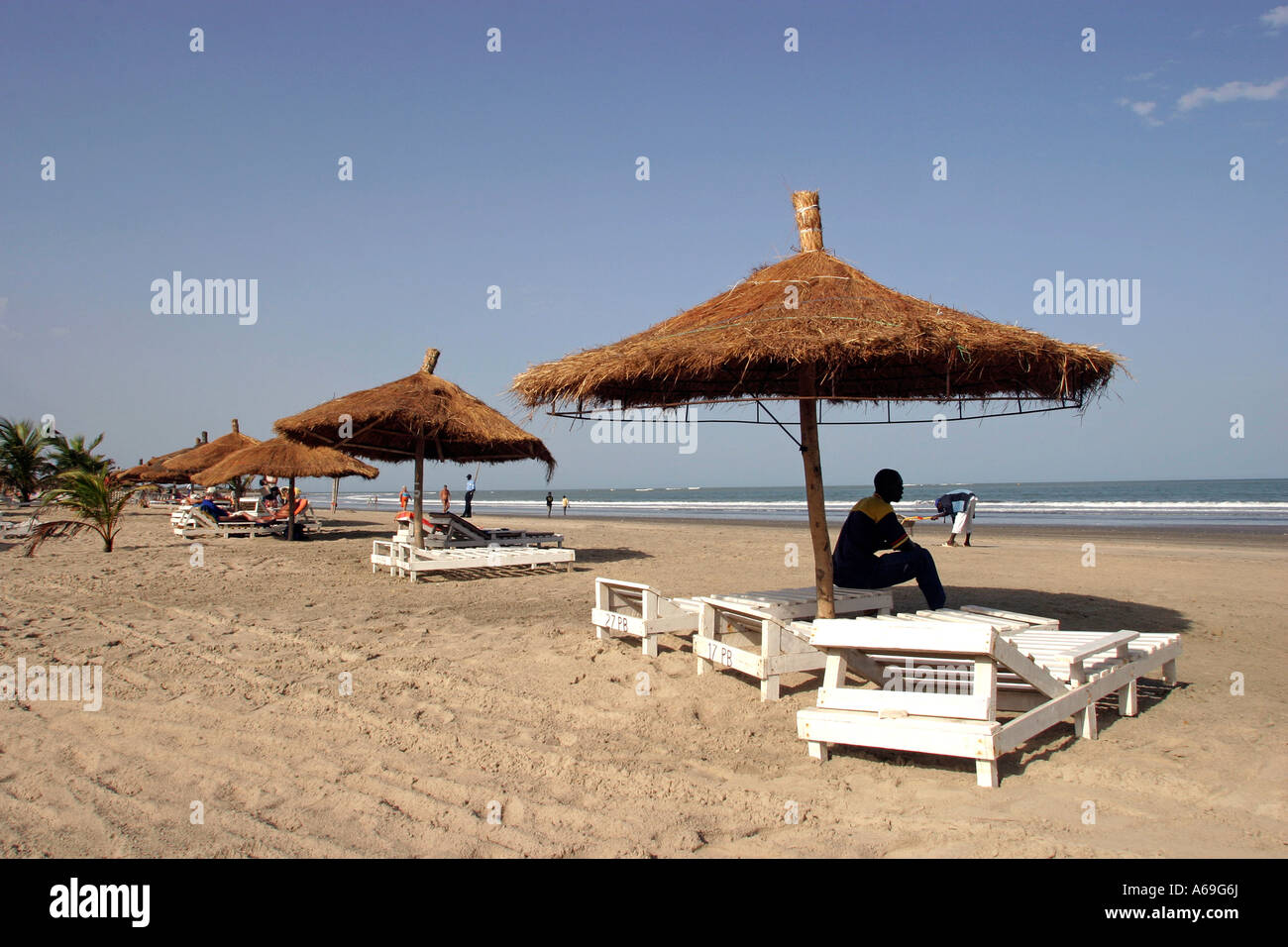 The Gambia Fajara beach empty sunbeds under parasols Stock Photo - Alamy