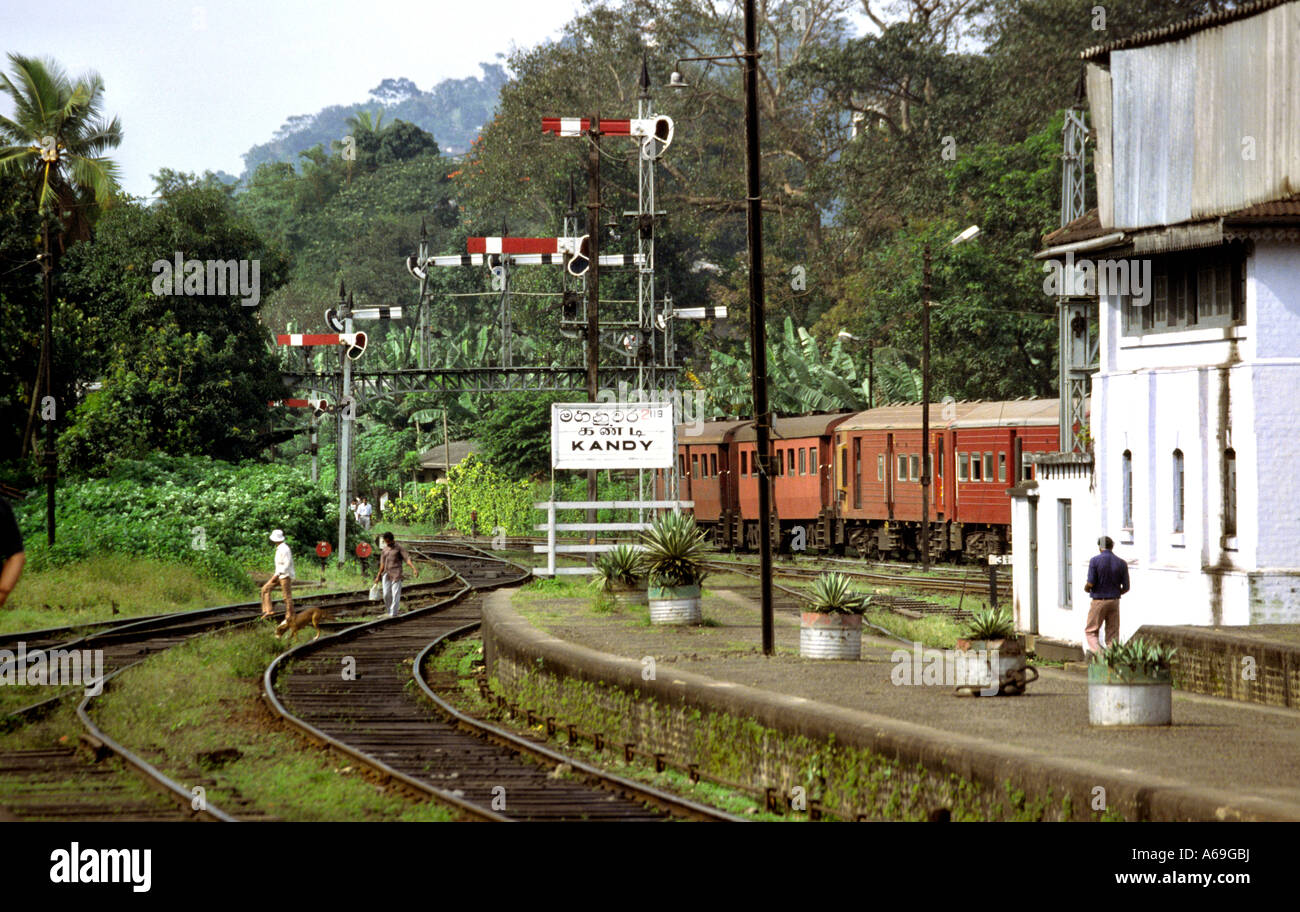 Sri Lanka Kandy transport passengers walking along track to the train ...