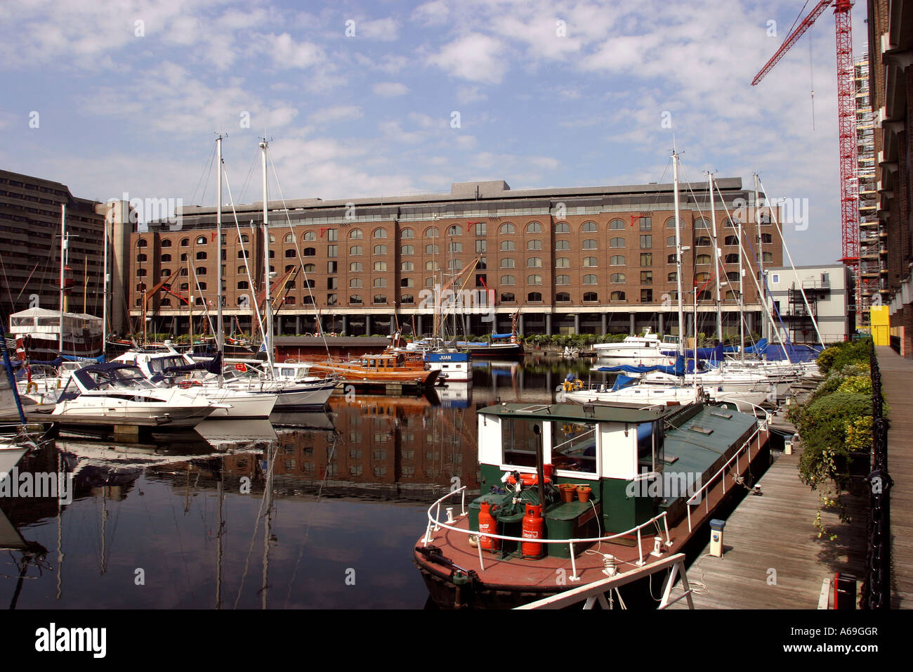 UK London Saint Katharines Dock boats in inner basin Stock Photo - Alamy