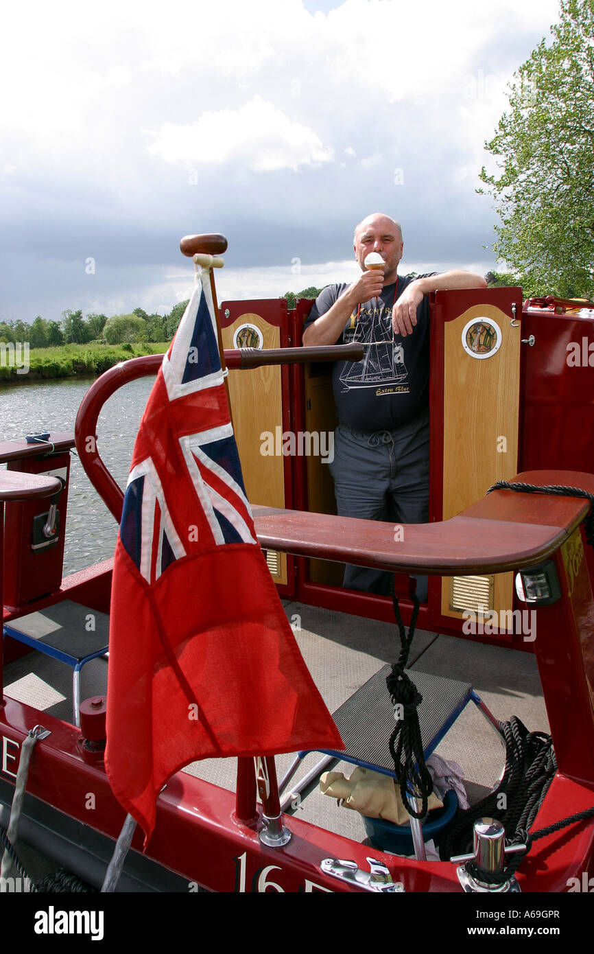 UK Norfolk Broads Coltishall River Bure Malcolm Richardson eating ice ...
