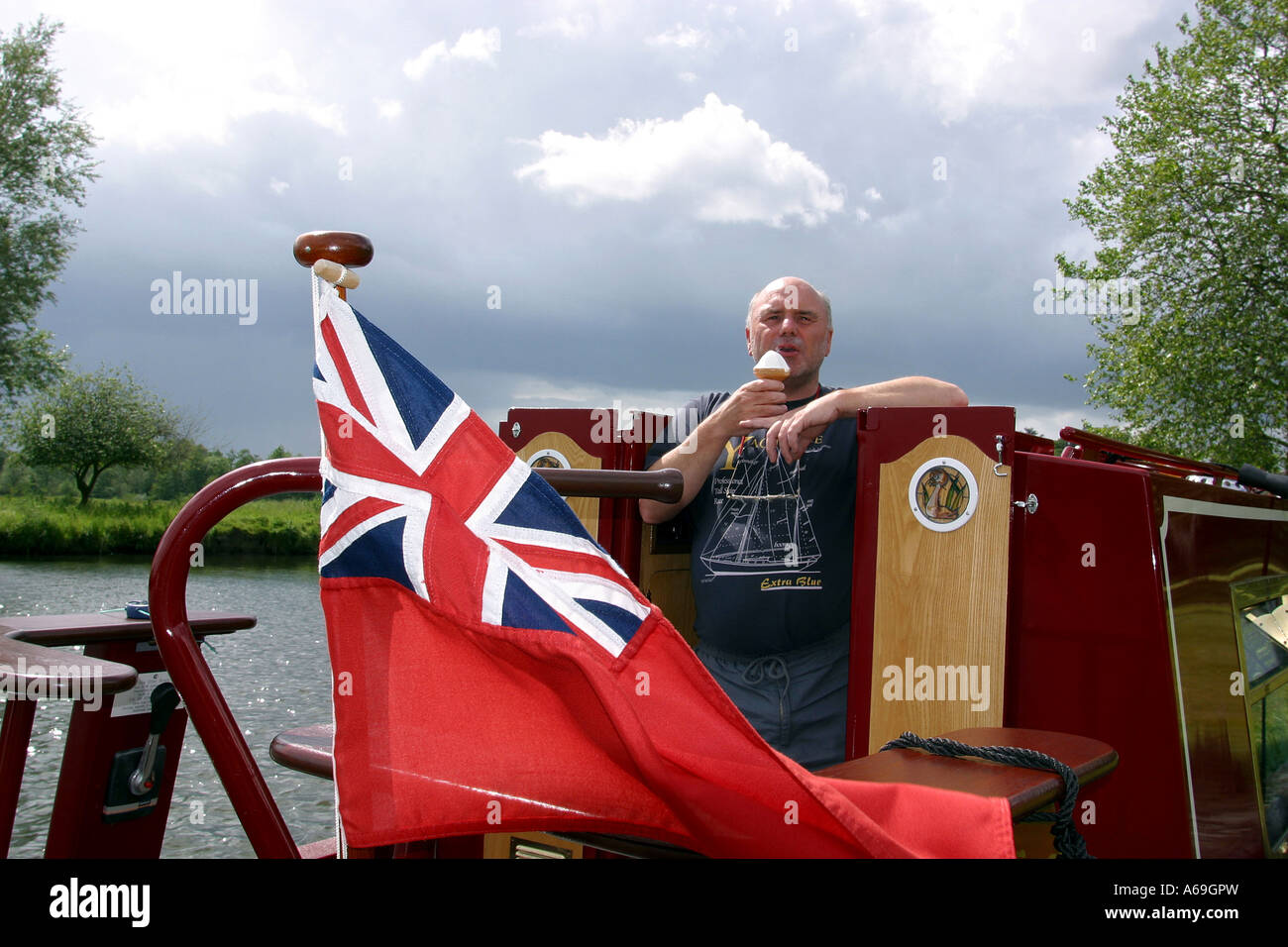 UK Norfolk Broads Coltishall River Bure Malcolm Richardson eating ice ...