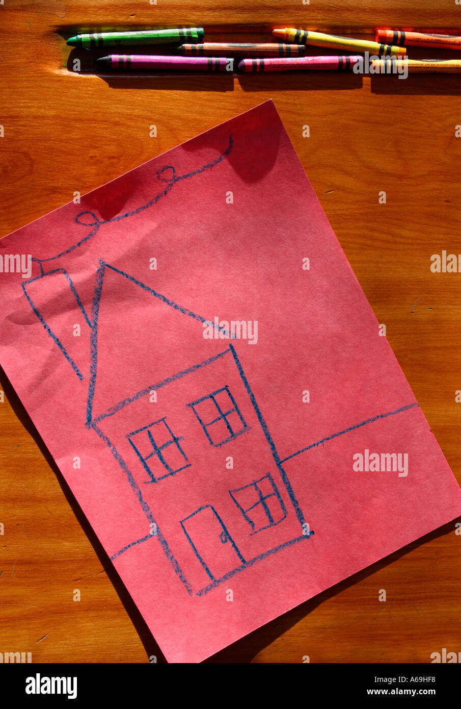 A child s drawing of a house on a student desk Stock Photo - Alamy